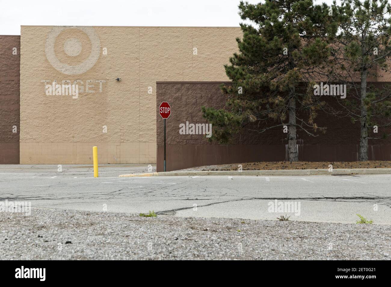 The faded outline of a logo sign outside of a closed Target Corporation ...