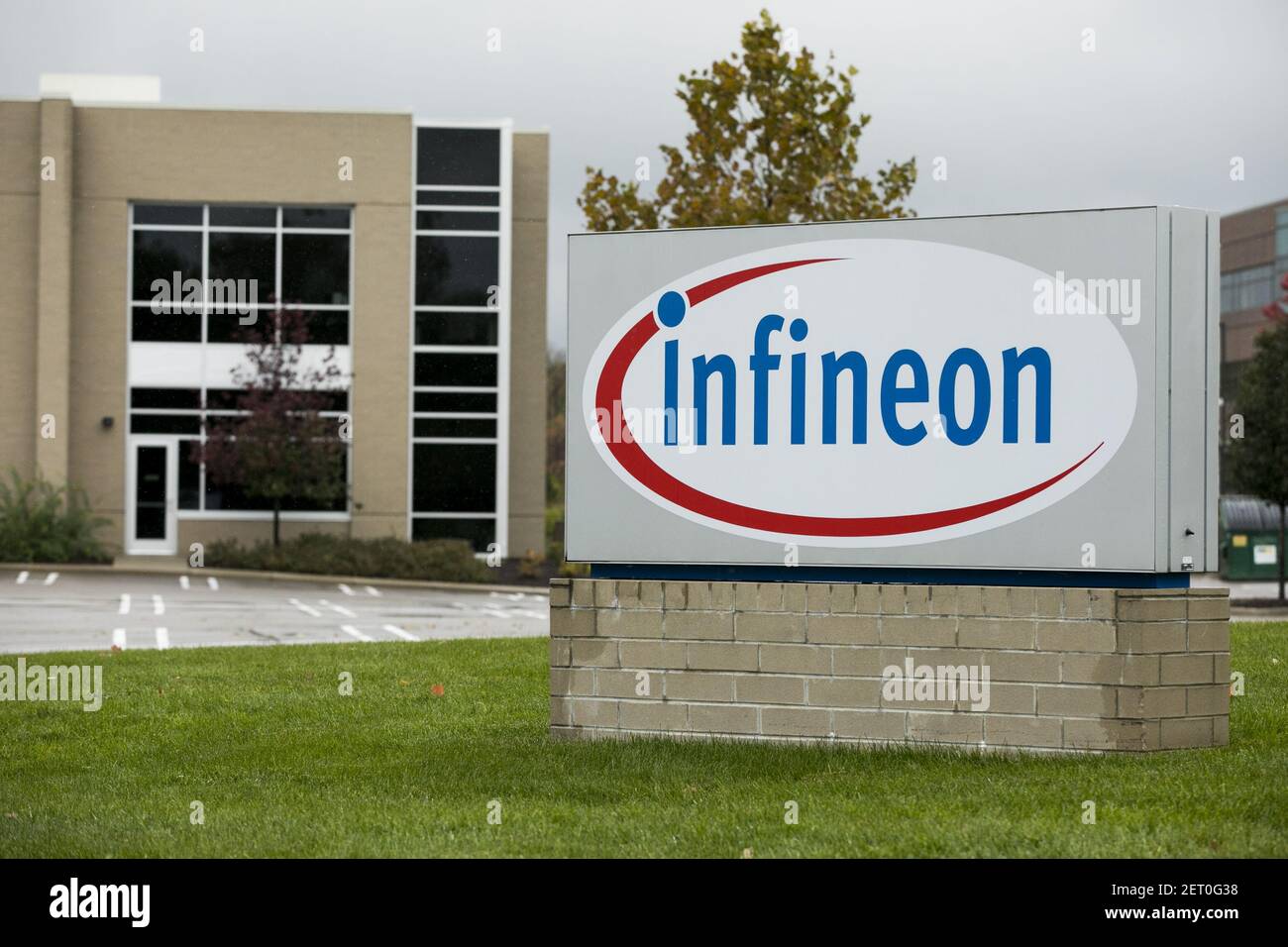 A logo sign outside of a facility occupied by Infineon Technologies in ...