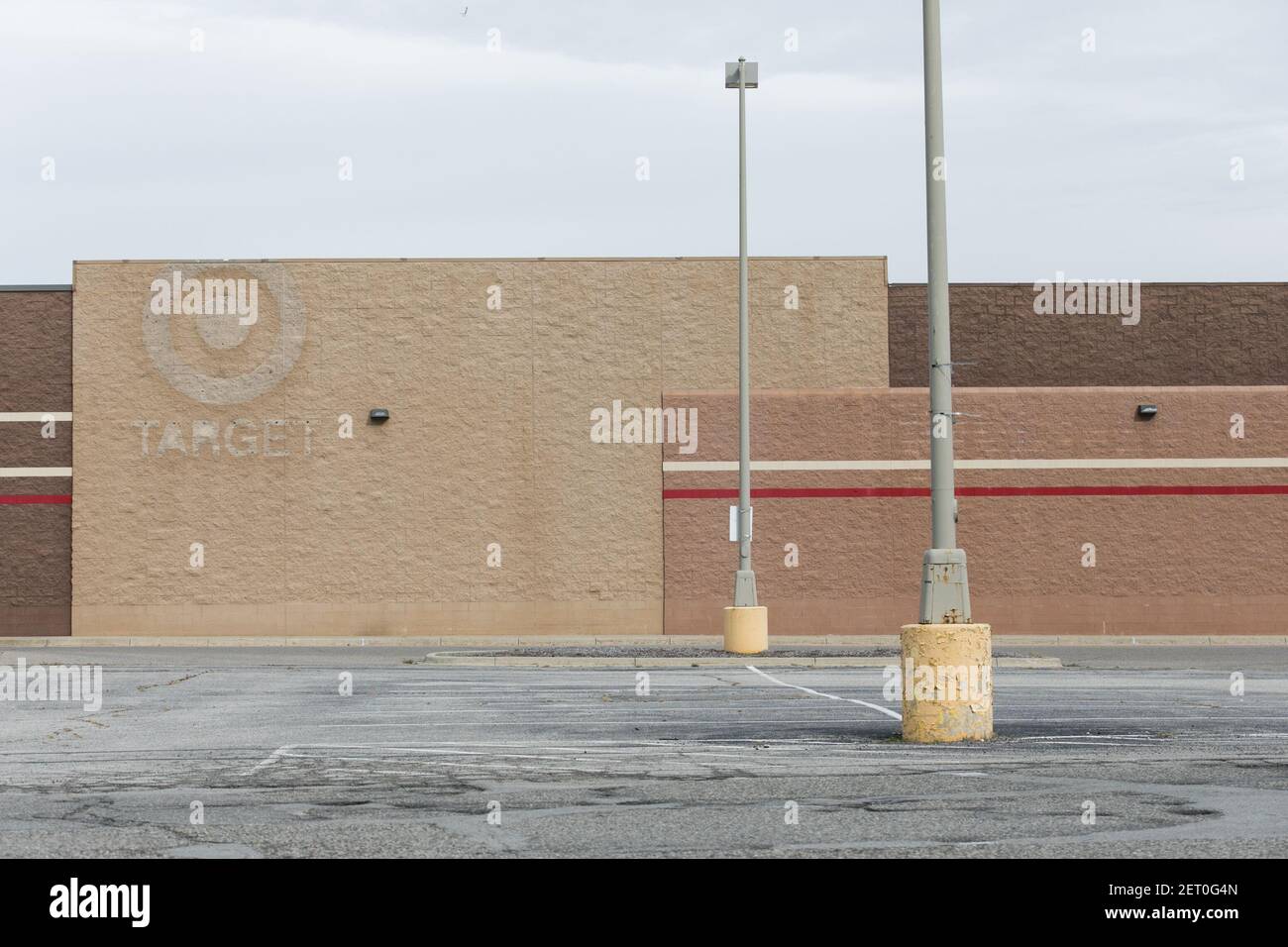 The faded outline of a logo sign outside of a closed Target Corporation ...