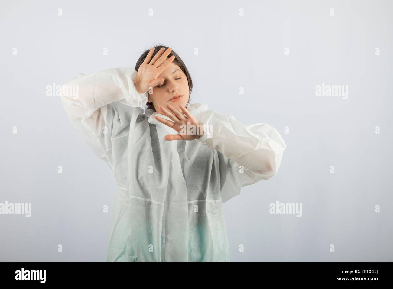 Portrait of young female doctor scientist wearing defensive lab coat ...