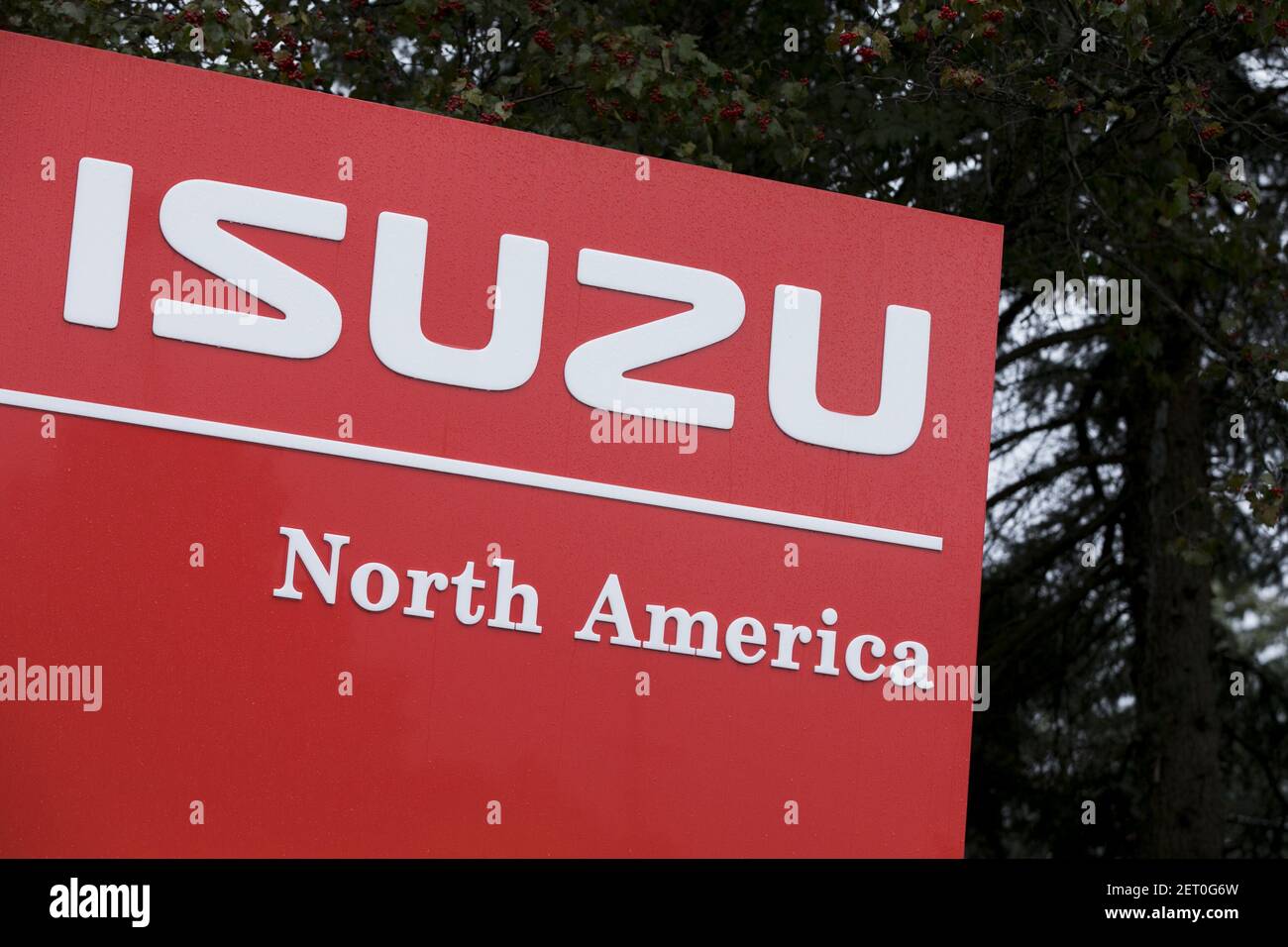 A logo sign outside of a facility occupied by Isuzu North America in ...