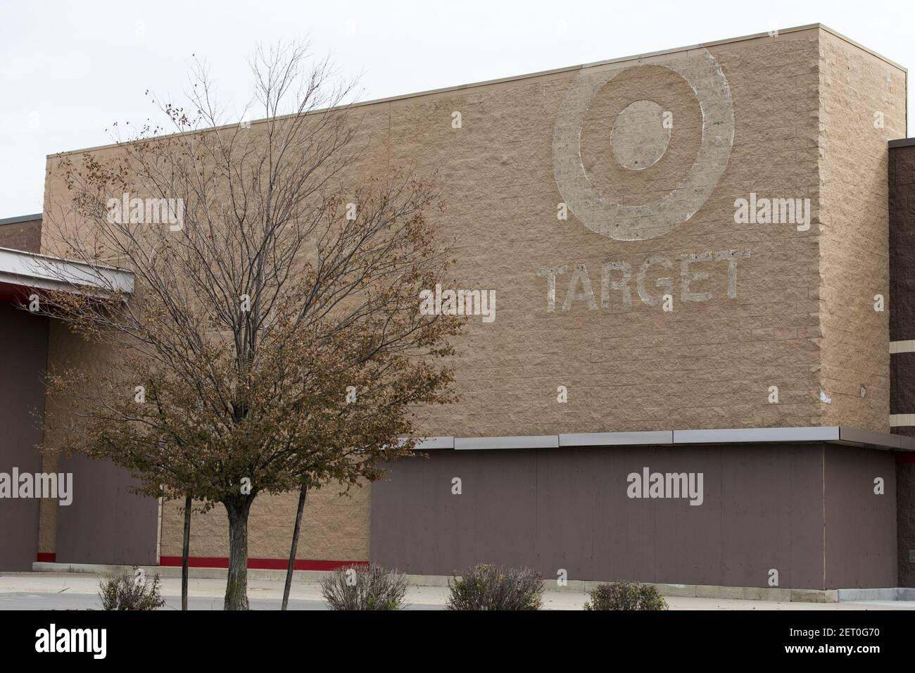 The faded outline of a logo sign outside of a closed Target Corporation ...