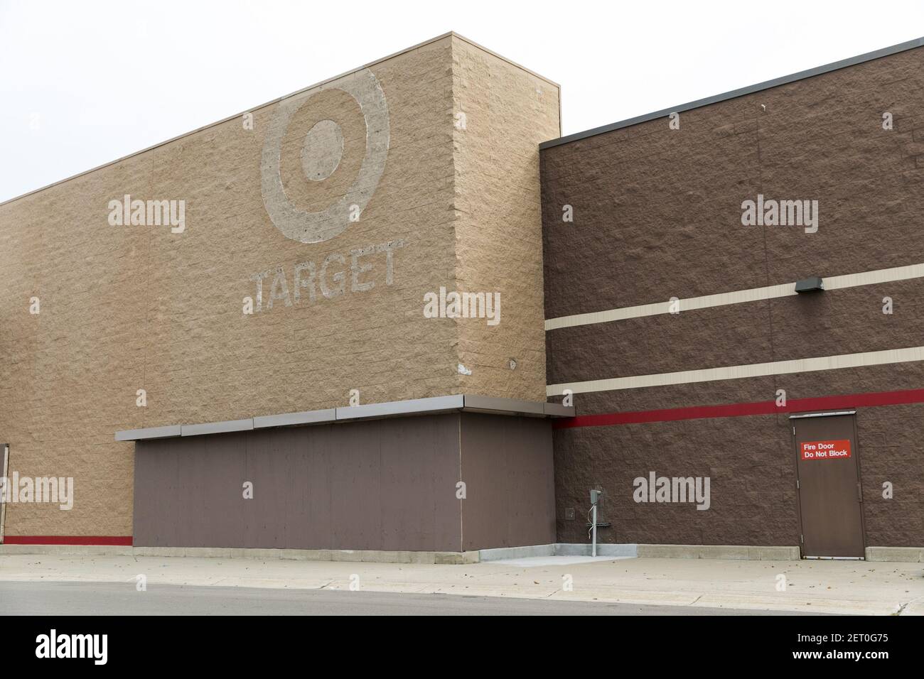 The faded outline of a logo sign outside of a closed Target Corporation ...
