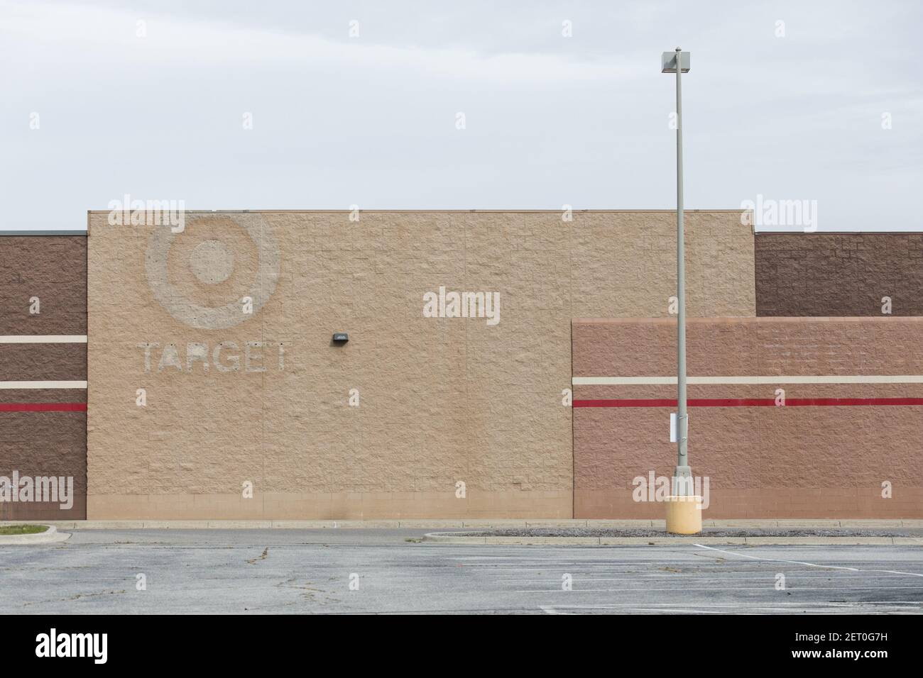 The faded outline of a logo sign outside of a closed Target Corporation ...
