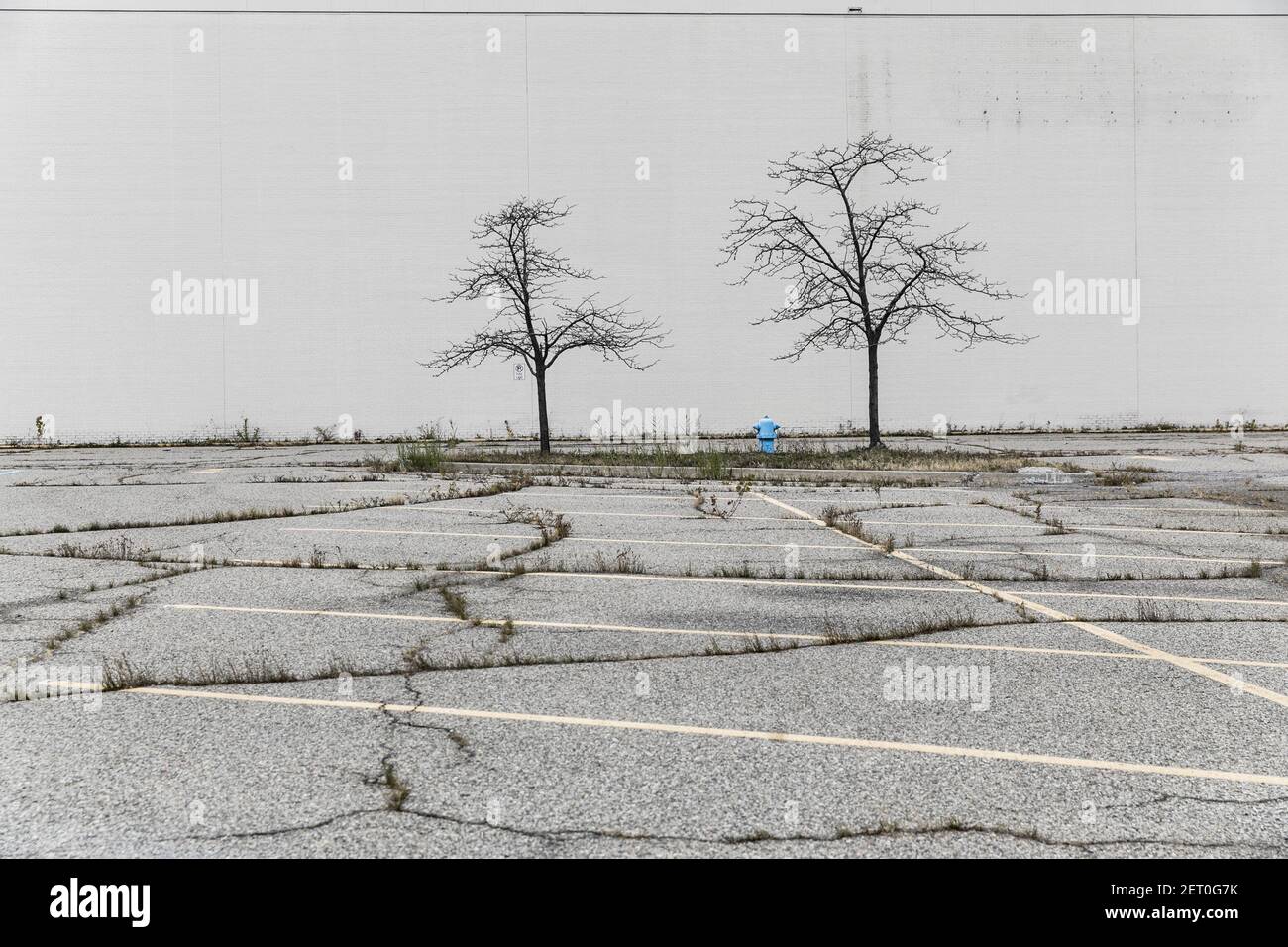 The faded outline of a logo sign outside of a closed Sears retail store ...