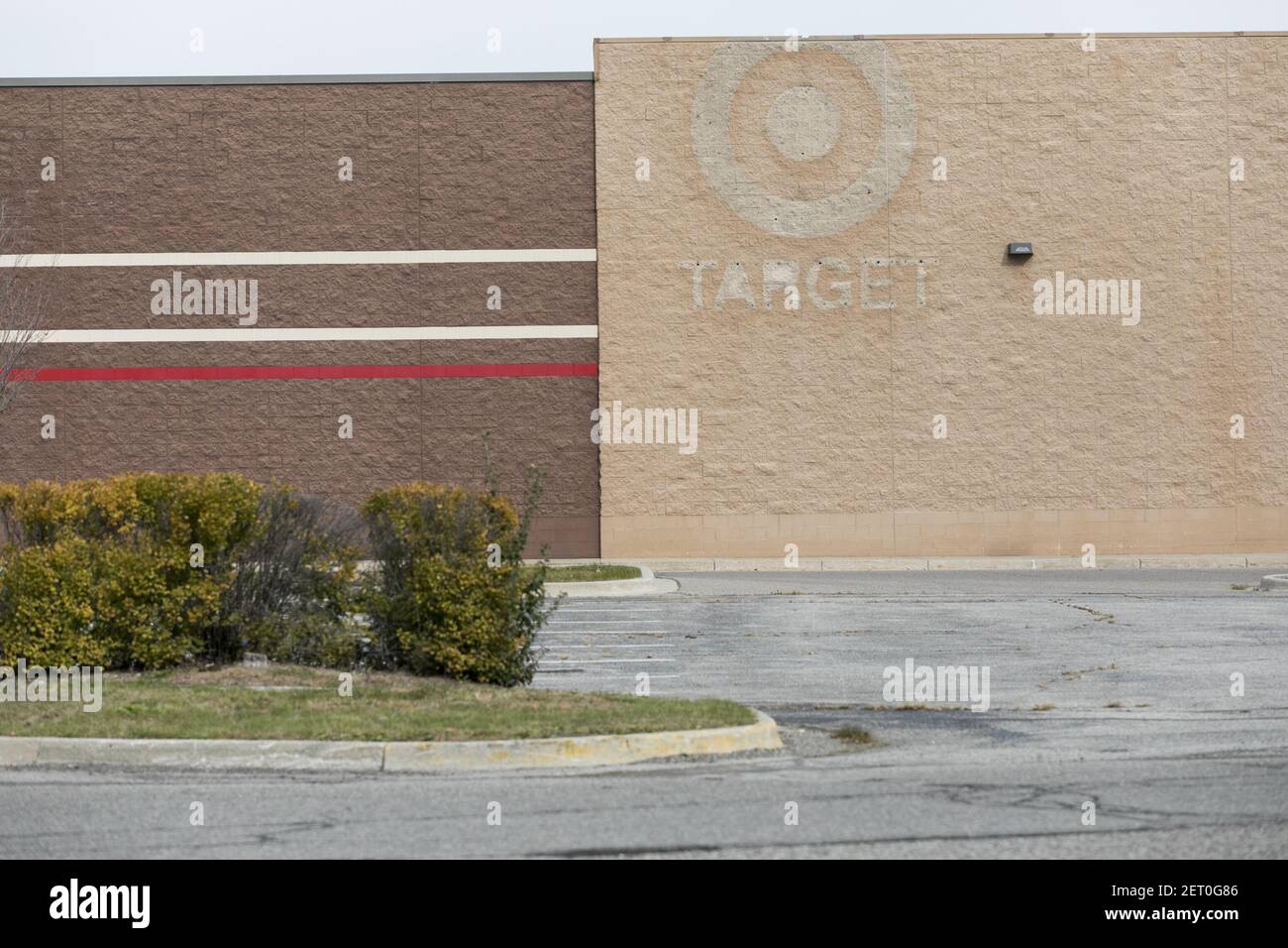 The faded outline of a logo sign outside of a closed Target Corporation ...