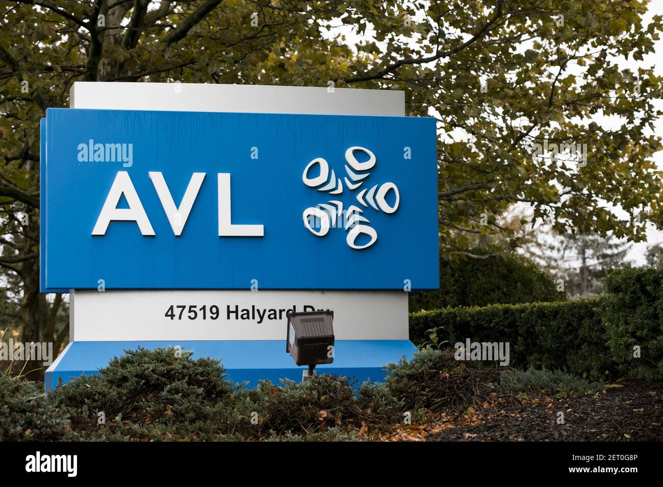 A logo sign outside of a facility occupied by AVL (Anstalt für ...