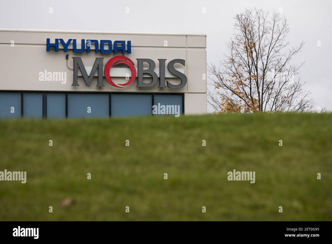 A logo sign outside of a facility occupied by Hyundai Mobis in Plymouth ...