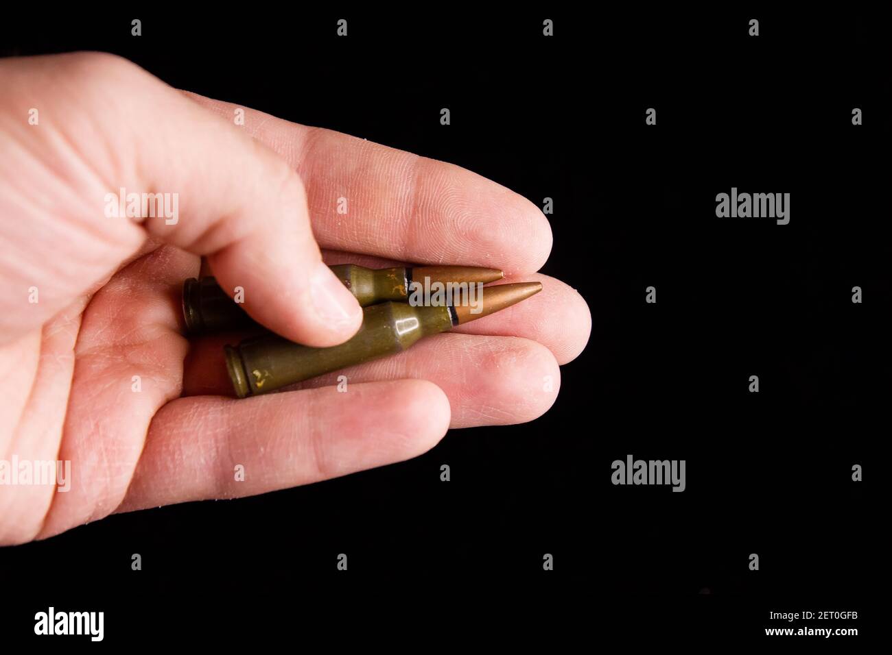 Hand holding bullet hi-res stock photography and images - Alamy