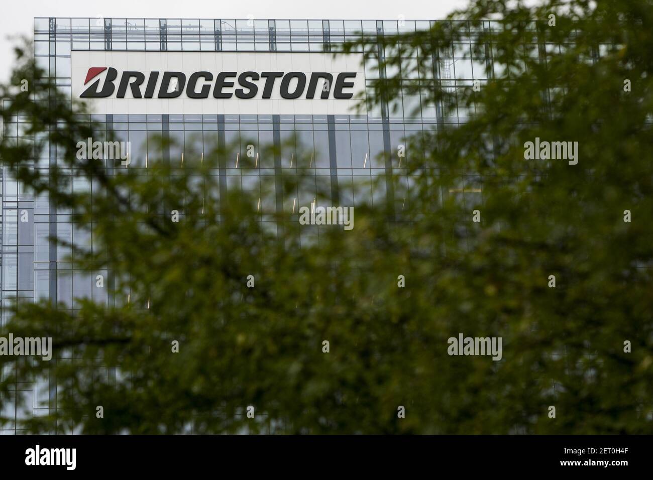 A logo sign outside of the headquarters of Bridgestone Americas in ...
