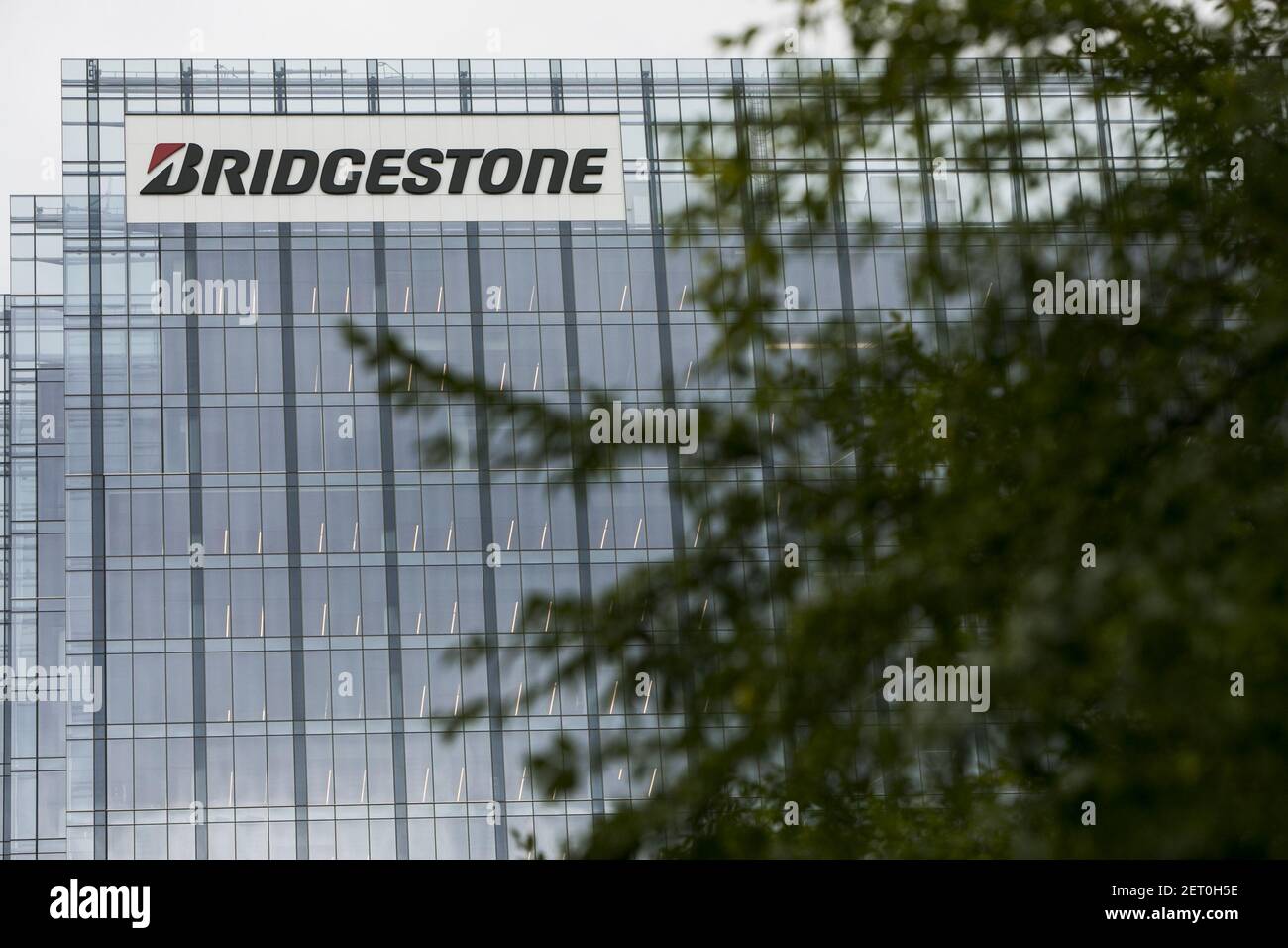 A logo sign outside of the headquarters of Bridgestone Americas in ...