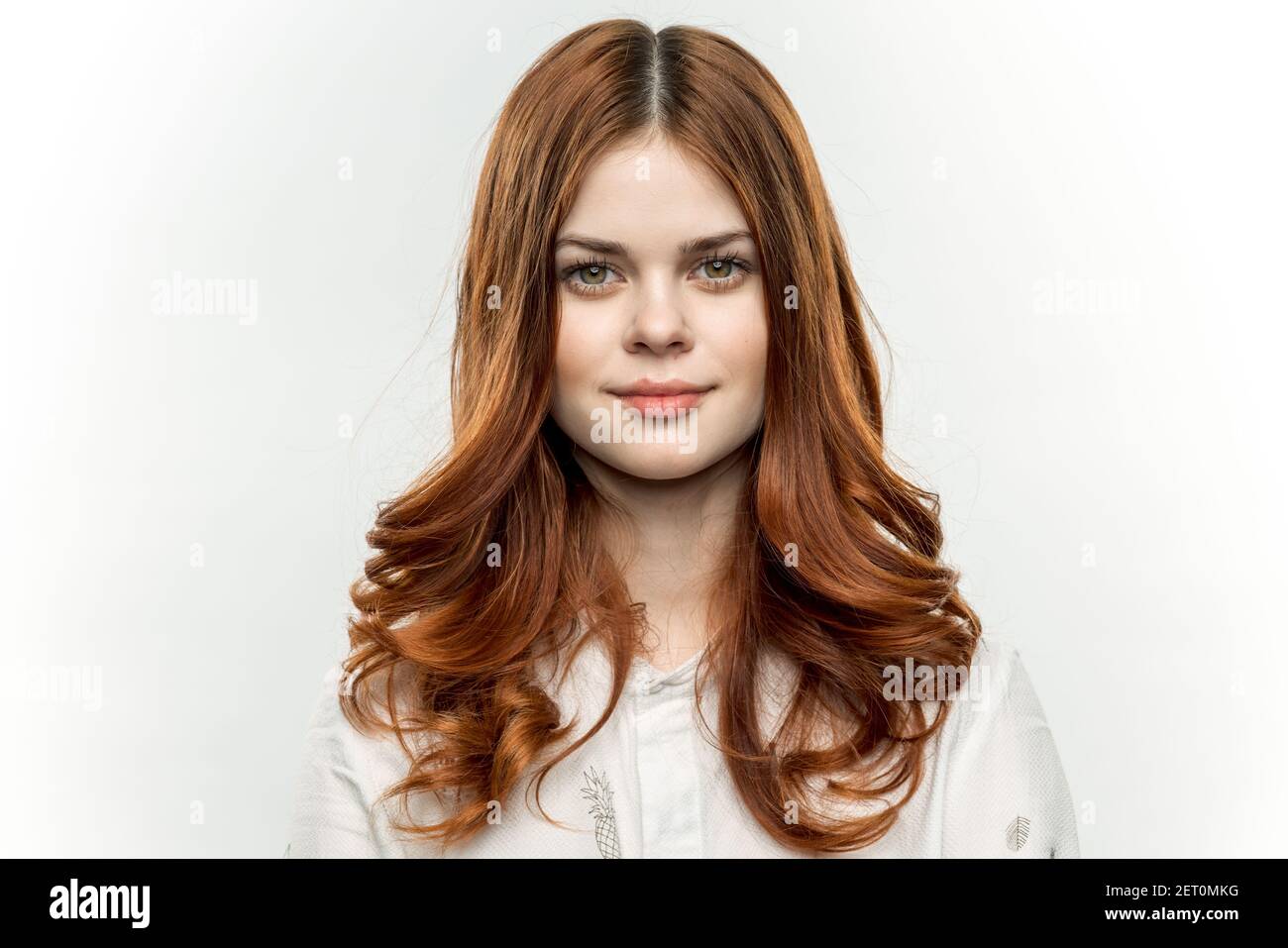 pretty woman with red hair smile cosmetics glamor light background ...