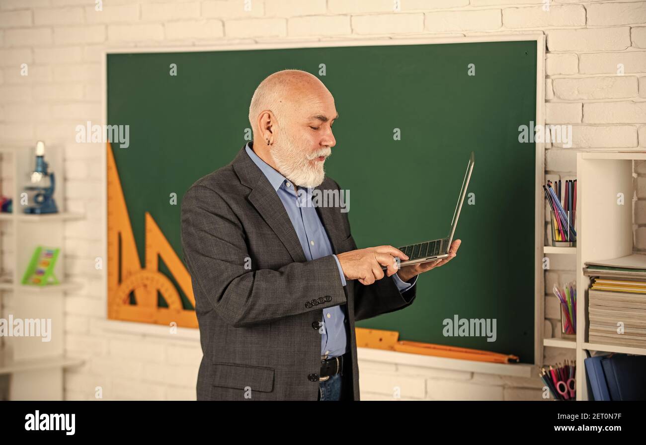 IT-teacher use laptop at lesson. new technology in modern education ...
