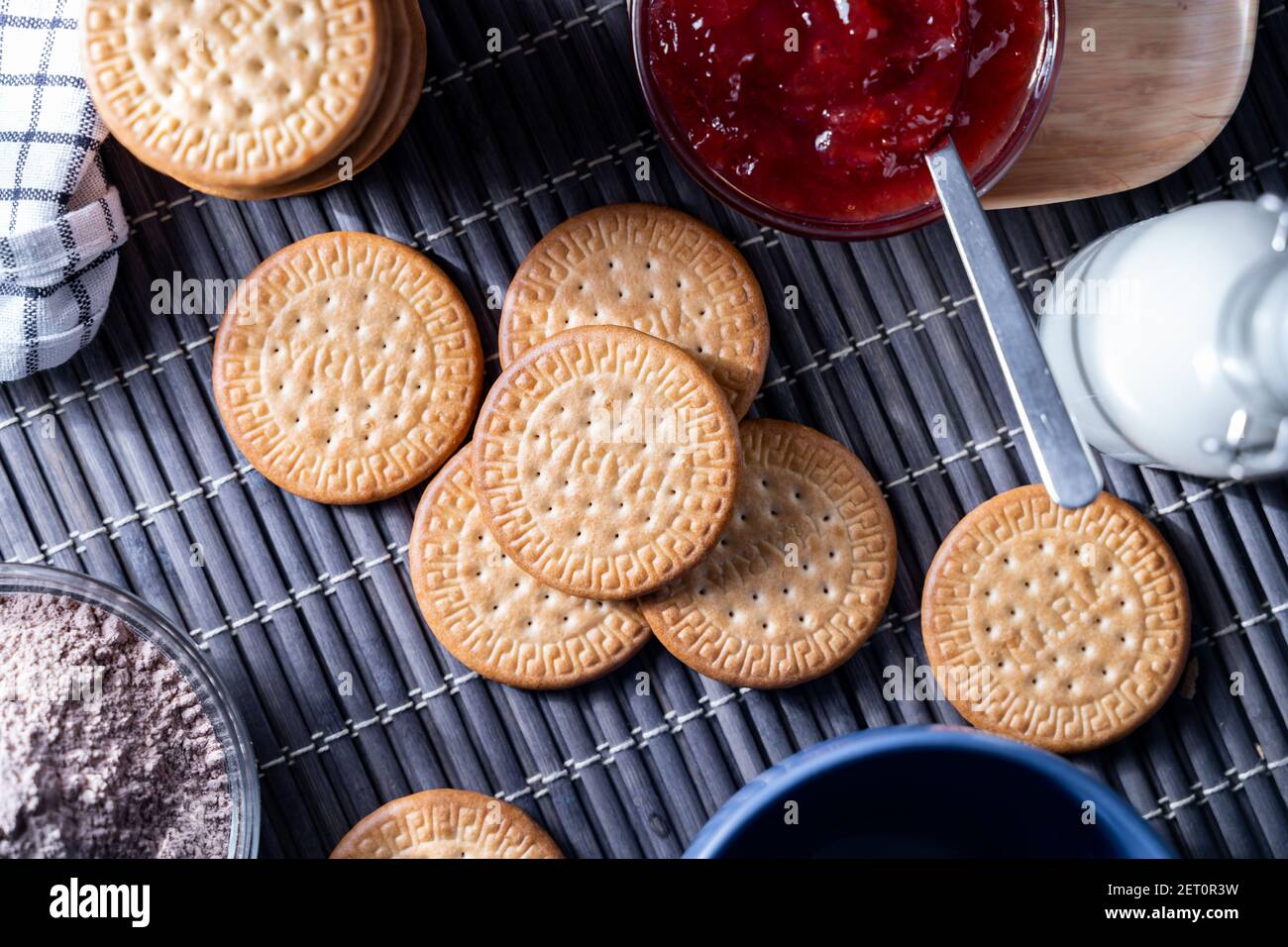 A top view of fresh Maria cookies (galletas Maria), strawberry jam ...