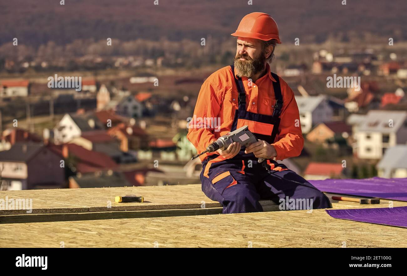 Roofer constructing roof. Man roofing surface. Materials requirements ...