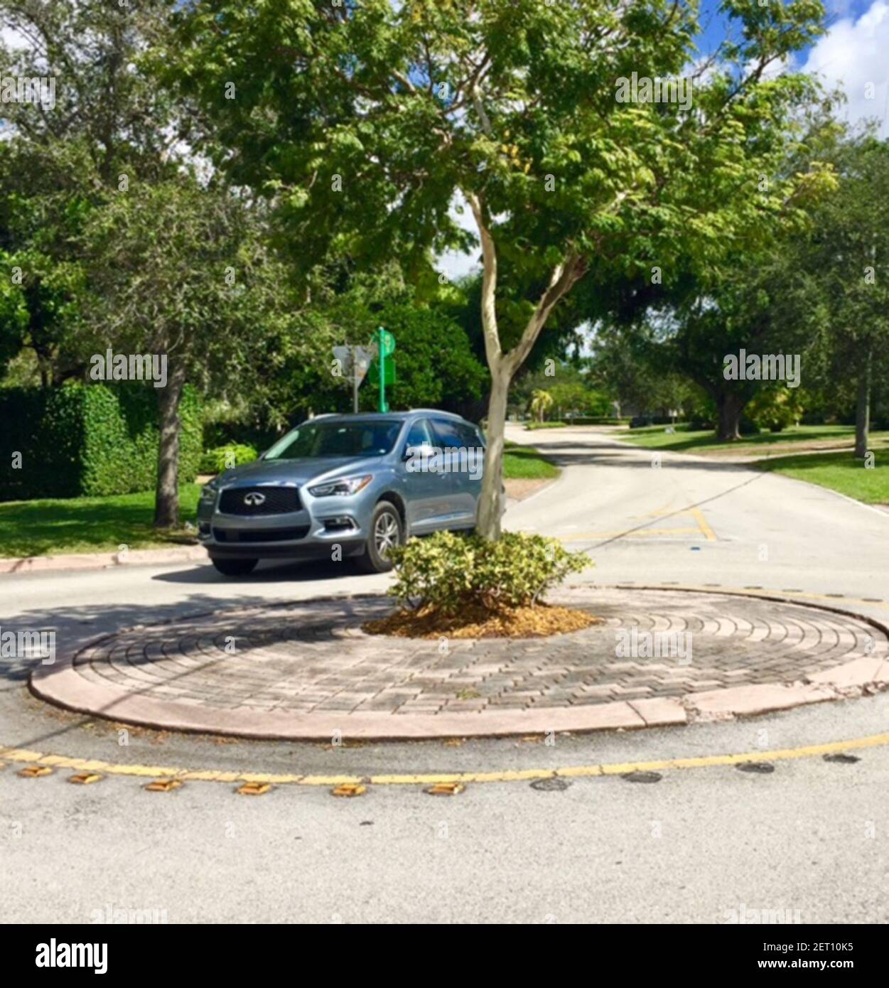 A roundabout or traffic circle in Coral Gables built to slow traffic at ...