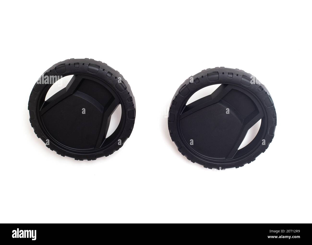 Black plastic wheels from a pressure washer on a white background ...