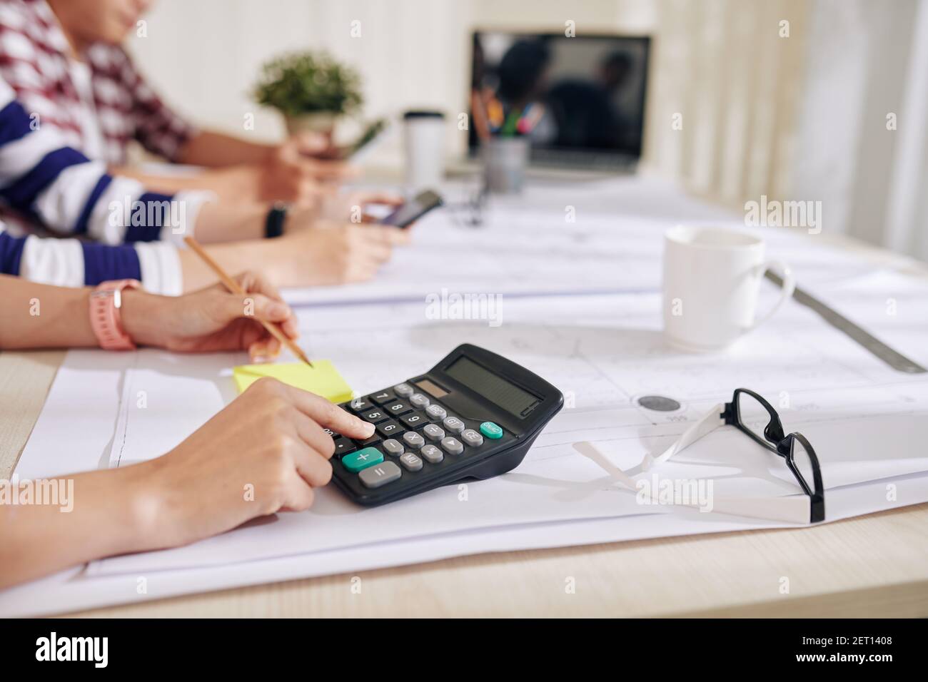 Architect making calculations Stock Photo - Alamy
