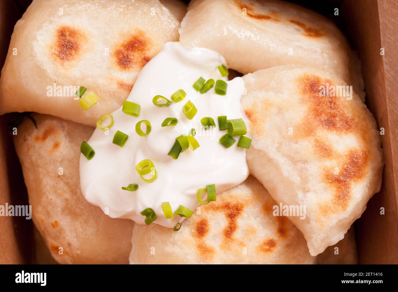 take out pierogi or perogie with sour cream, food truck style Stock ...