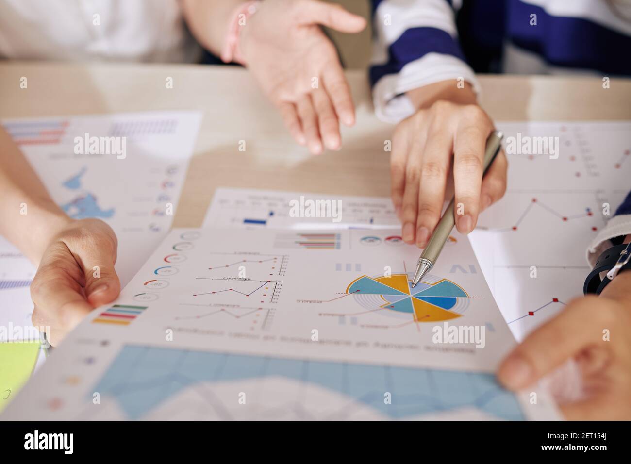 Financial experts analyzing report Stock Photo - Alamy