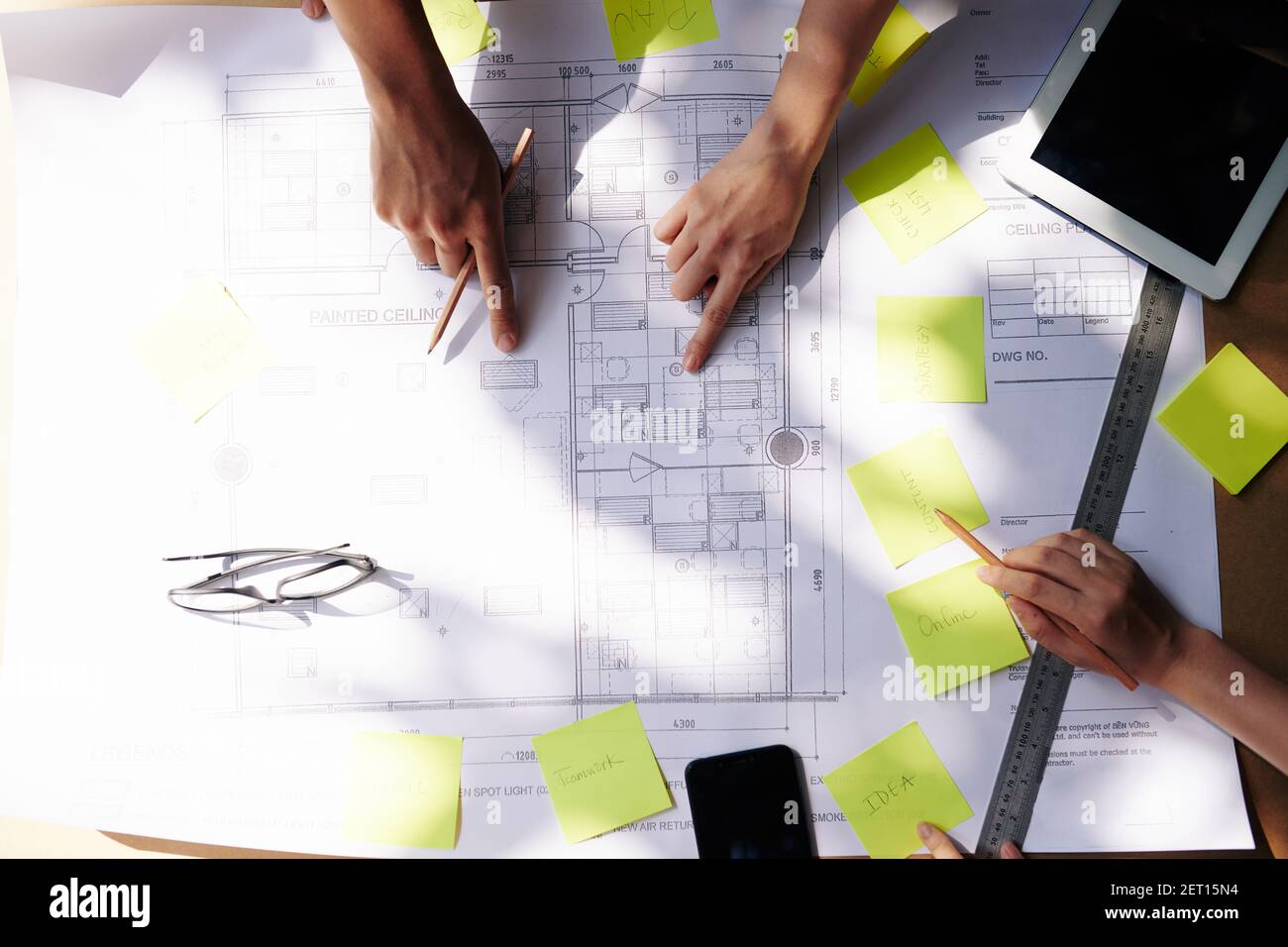 Engineers analyzing blueprint construction hi-res stock photography and ...