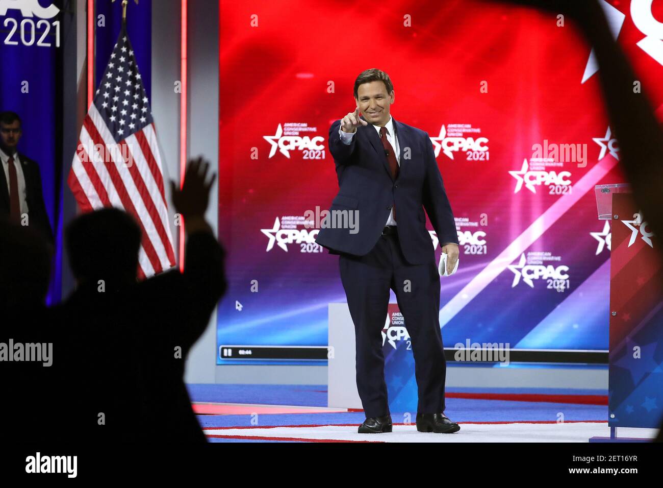 Florida Governor Ron DeSantis waves to a cheering crowd at CPAC at the ...