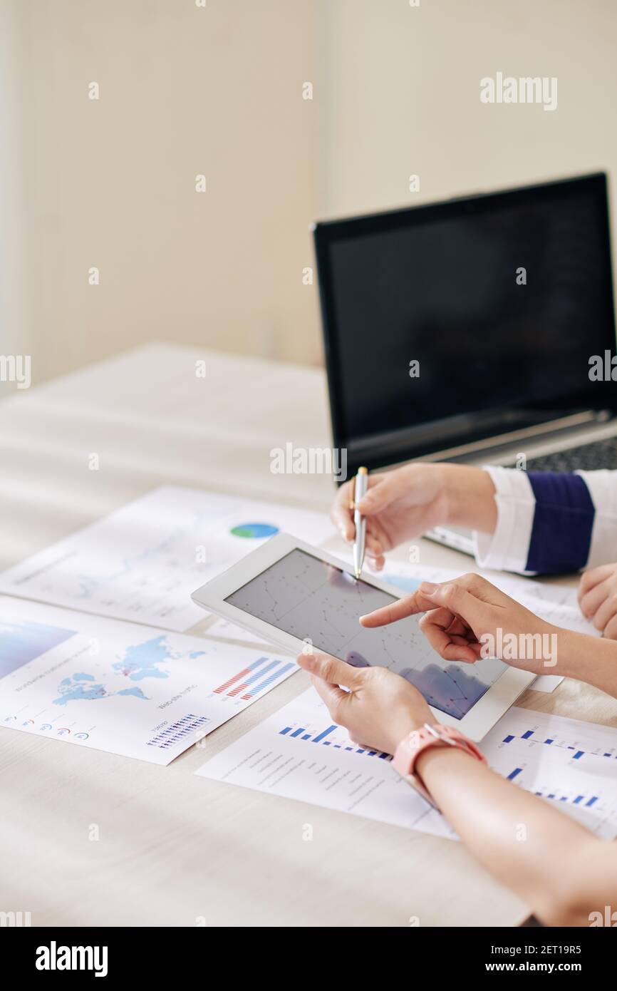 Business people analyzing statistics Stock Photo - Alamy