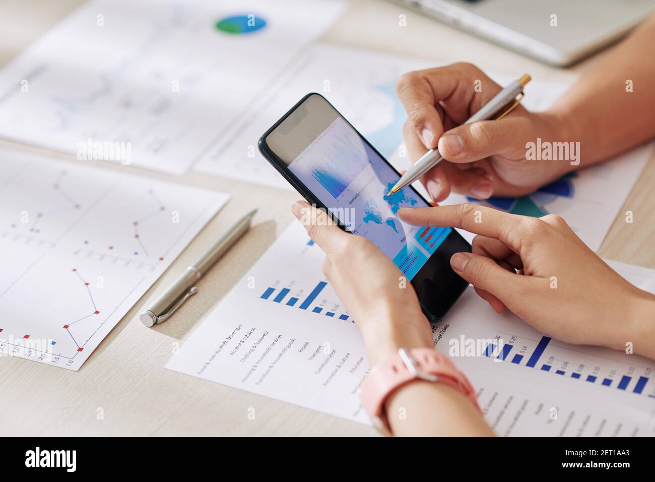 Business people checking online sales Stock Photo - Alamy