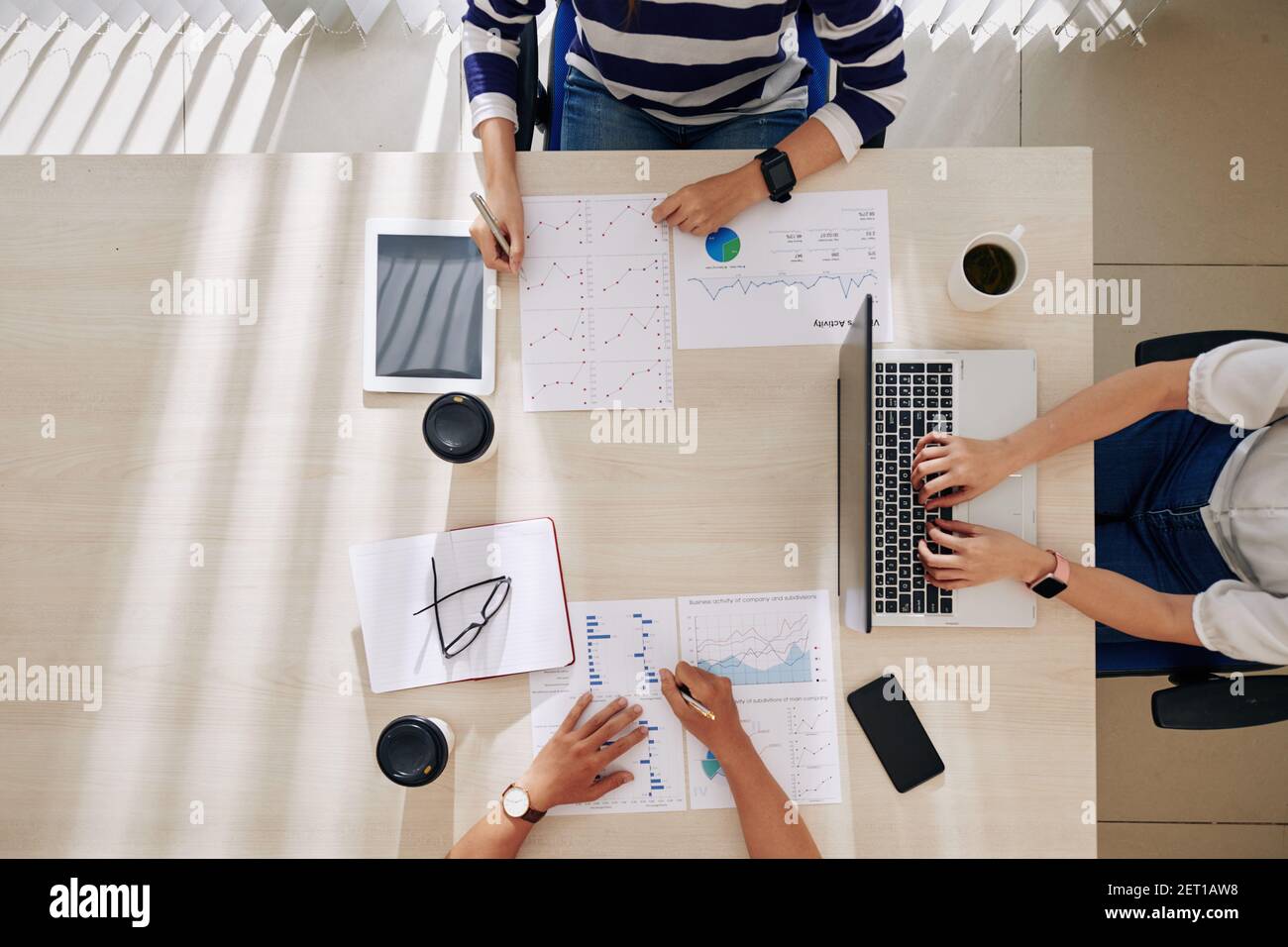 Business people working on project Stock Photo - Alamy