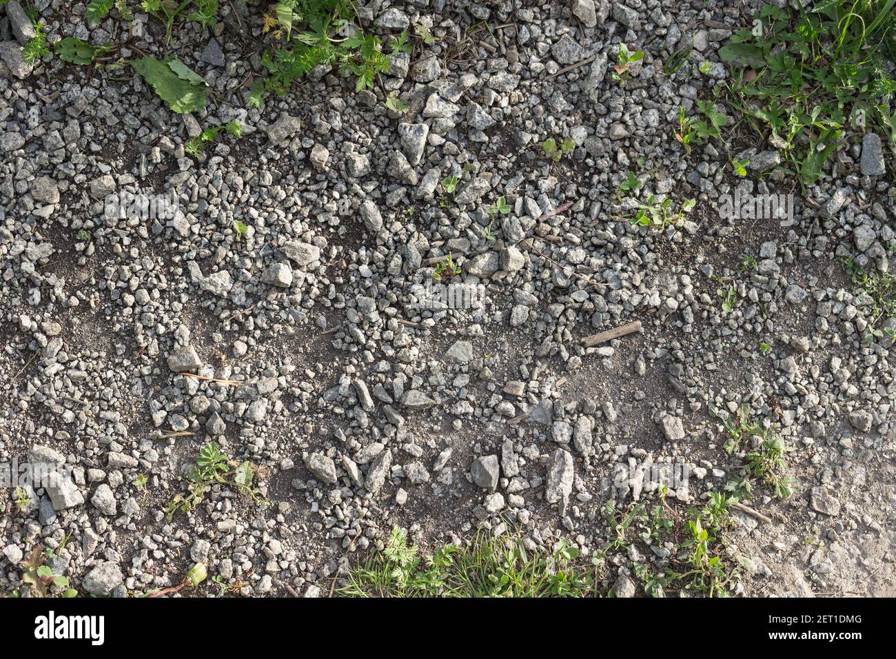 Natural texture with stones, earth and grass Stock Photo - Alamy