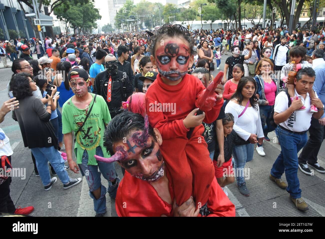 People disguised as monsters take part in the 20th annual Zombie Walk ...