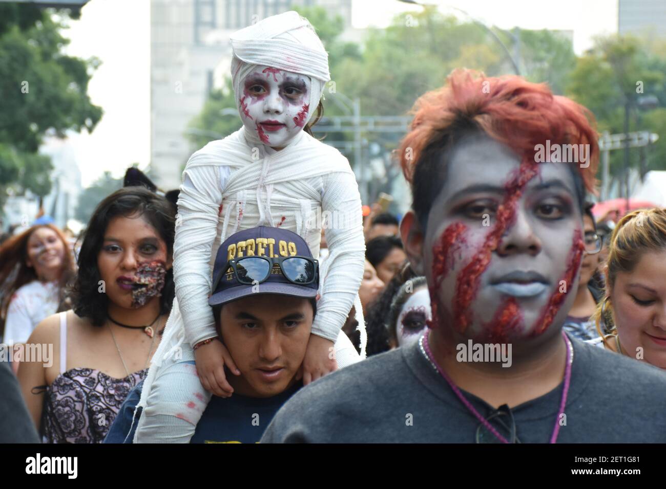 People disguised as monsters take part in the 20th annual Zombie Walk ...