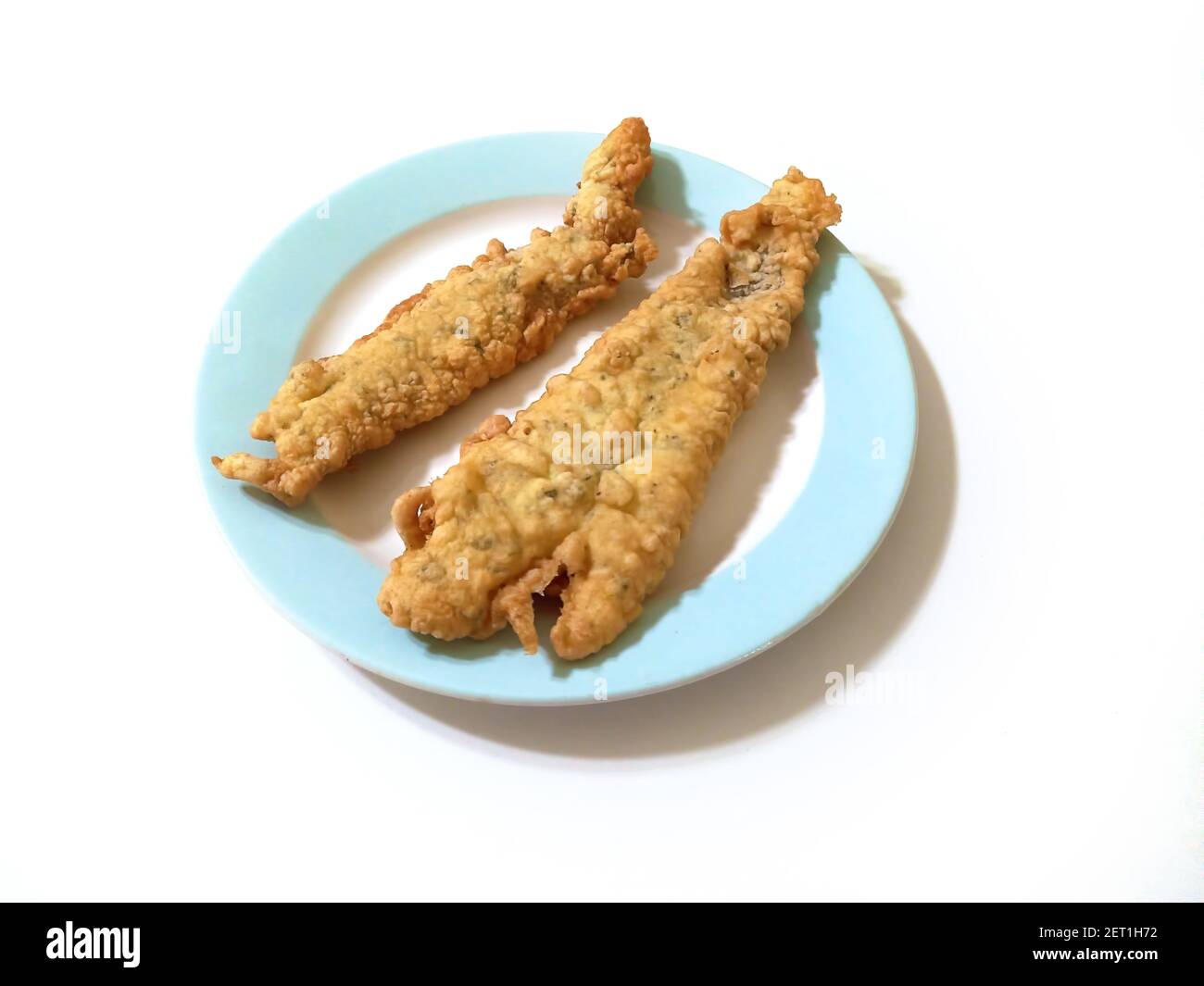 High angle shot of fresh tasty fried battered hake fish filet on a ...