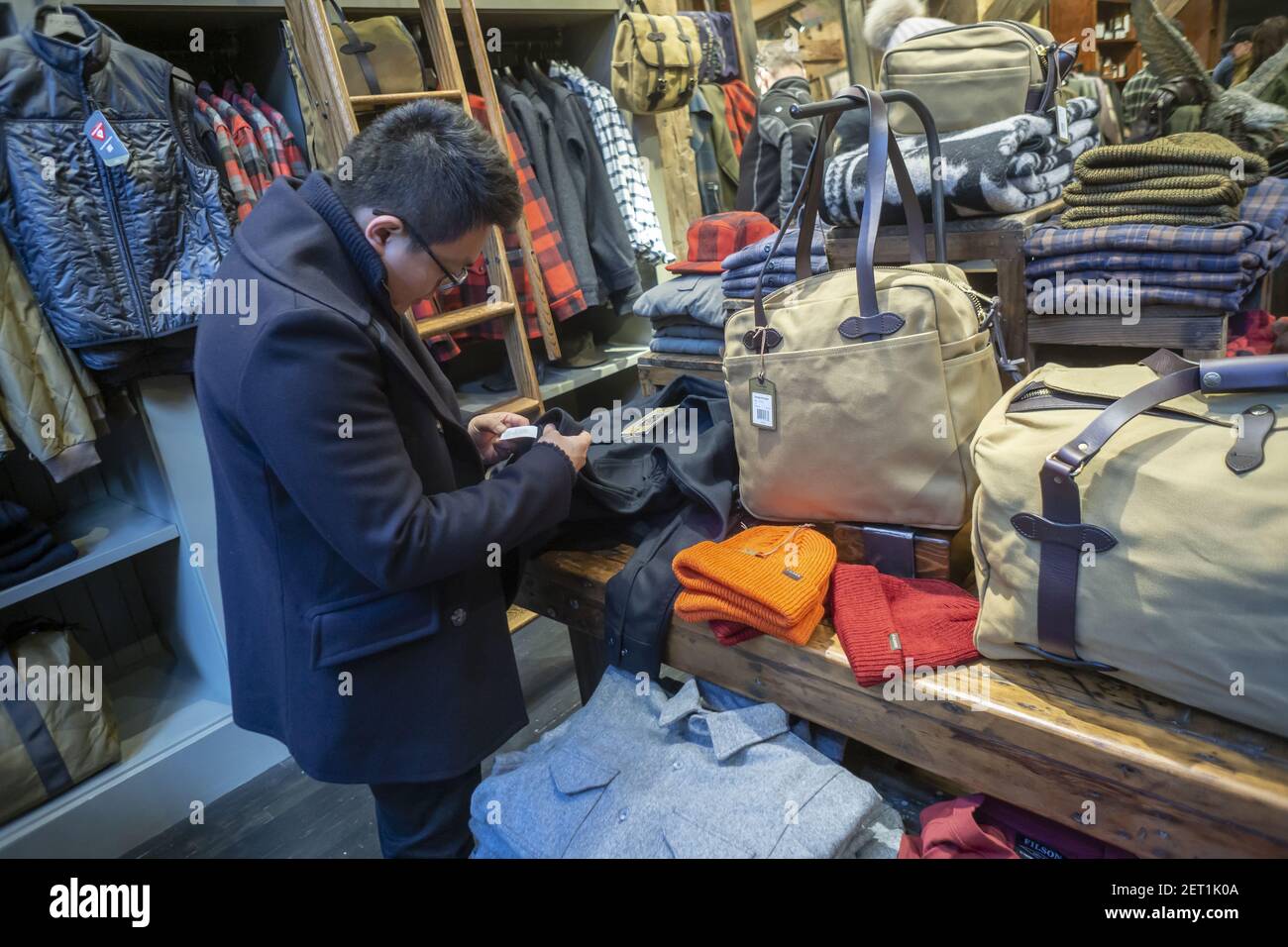 Shoppers invade the new Filson store on Union Square in New York during ...