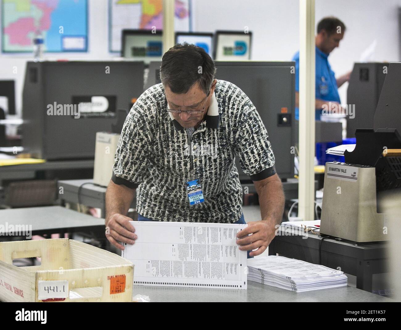 Miami-Dade Election Center supervisors recount the ballots and are ...