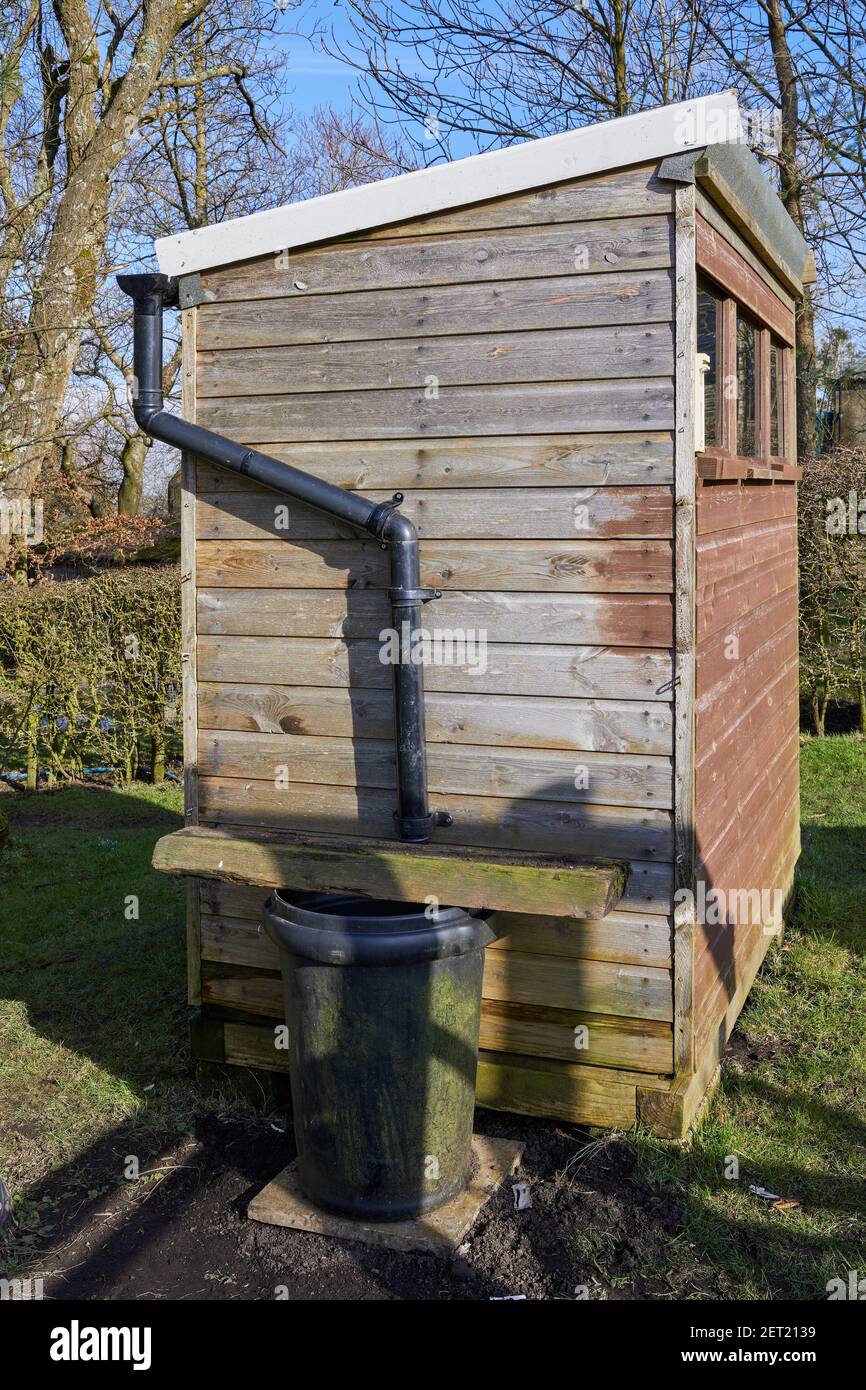 Newly fitted plastic guttering to the garden shed on the working ...