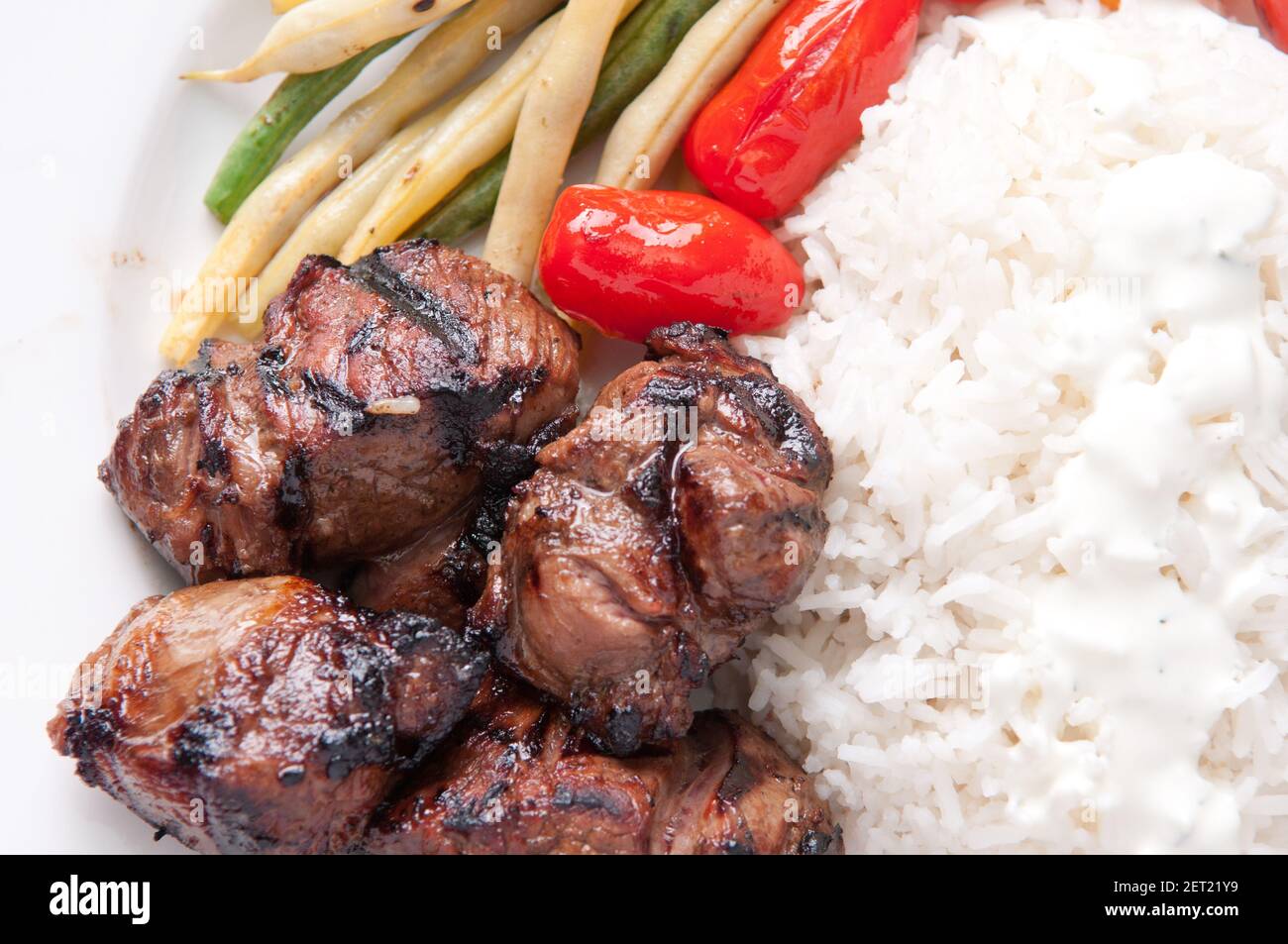 healthy bbq beef kabobs with roasted vegetables and white rice Stock Photo - Alamy