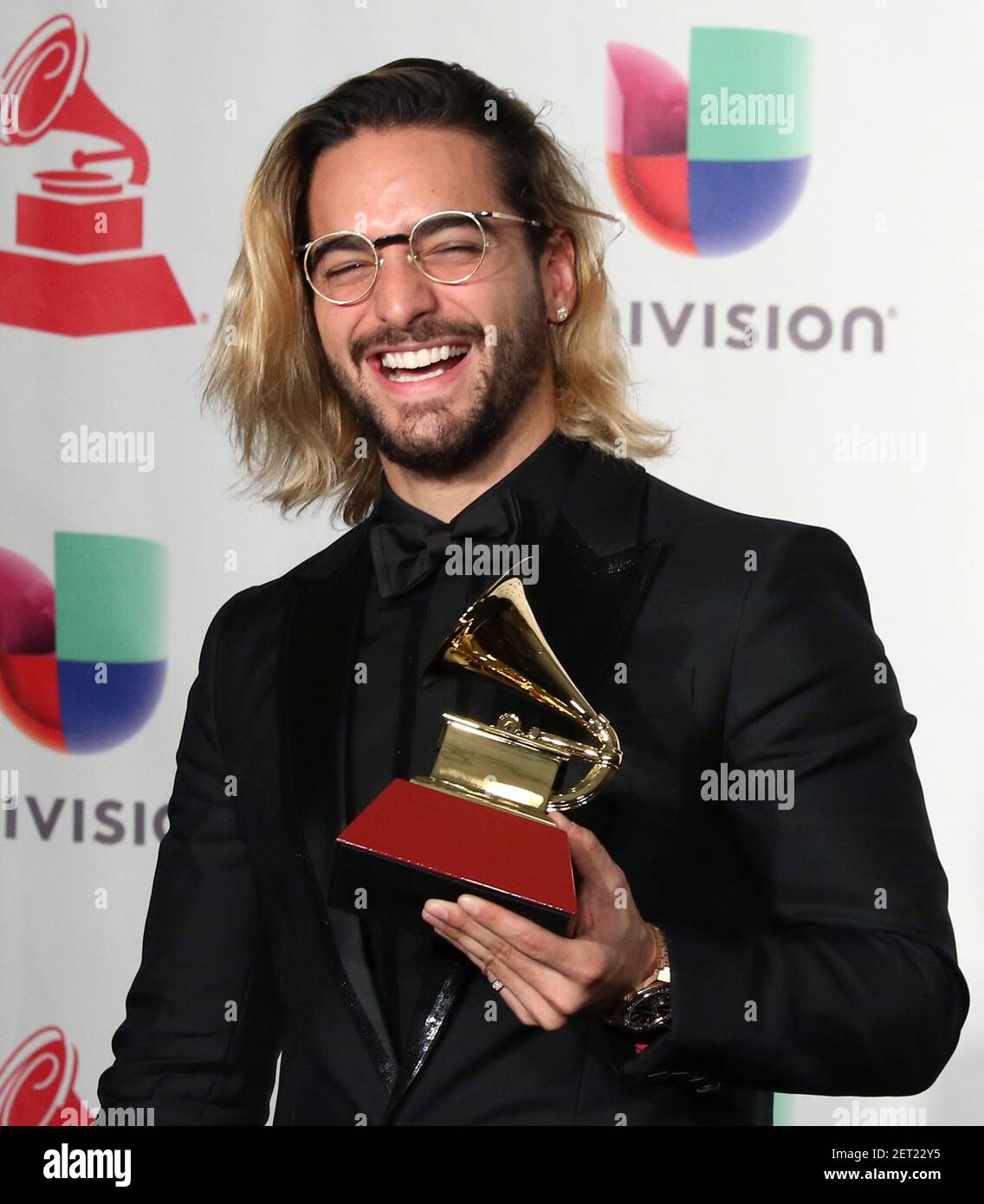 Maluma poses for a photo after winning Best Contemporary Pop Vocal ...