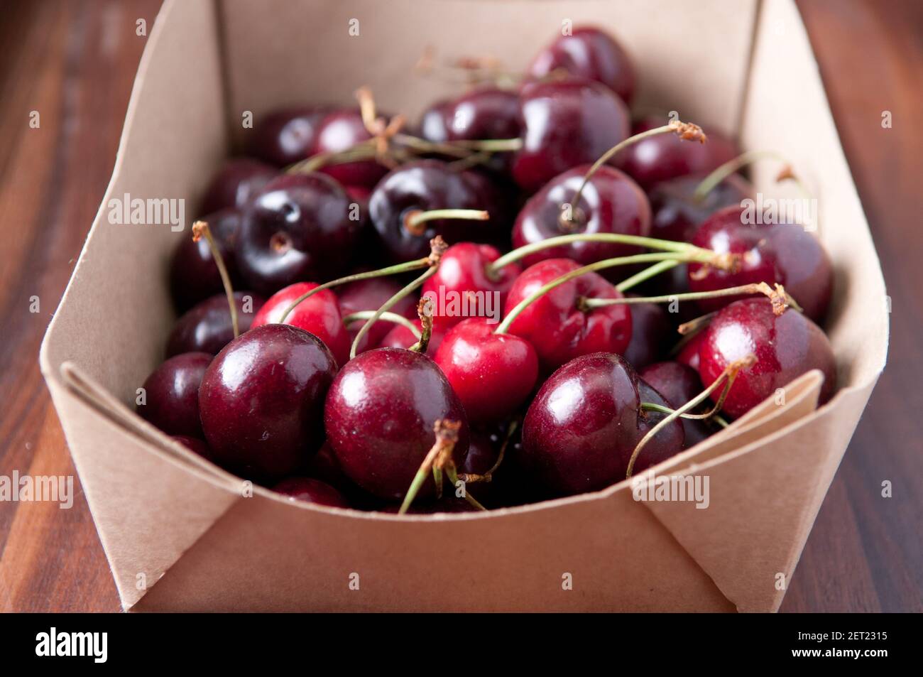 red bing cherries in take-away boxes Stock Photo - Alamy