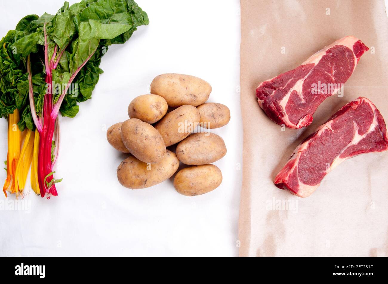 uncooked ingredients for steak and vegetable meal Stock Photo - Alamy