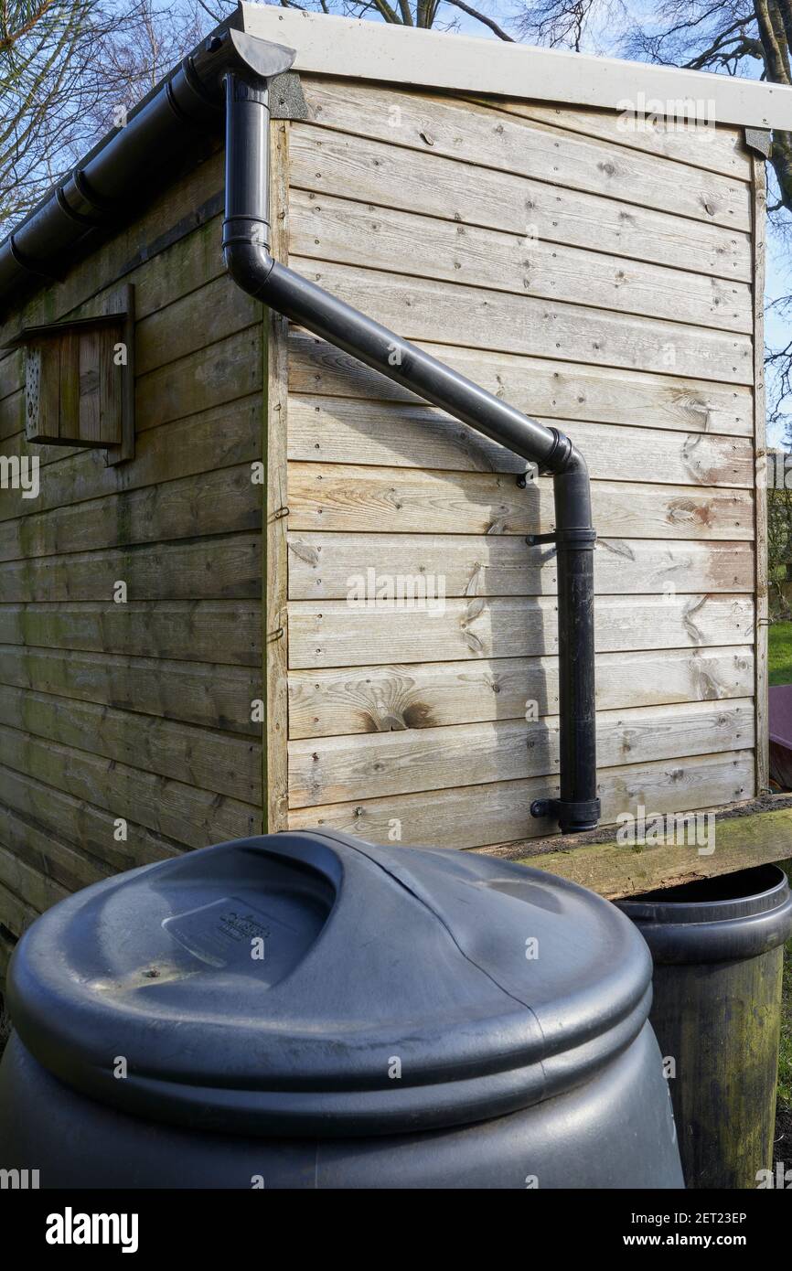 Newly fitted plastic guttering to the garden shed on the working ...