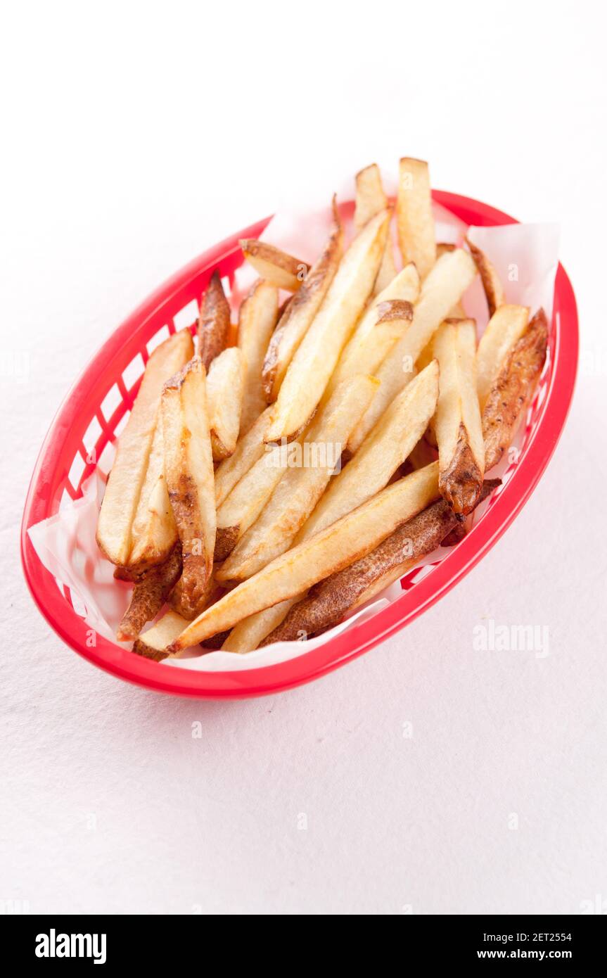 hand cut organic french fries in a red basket Stock Photo - Alamy