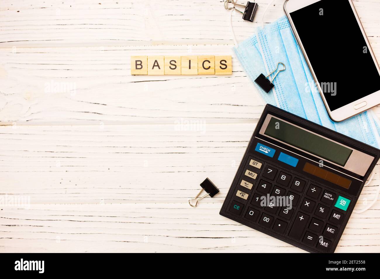 Basic income written on wood blocks with medical mask, calculator on ... Basic income written on wood blocks with medical mask, calculator on ...
