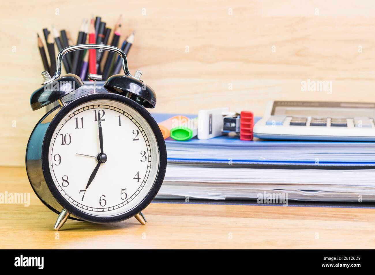 7 AM Clock on work desk in the office Time of businessman working ...