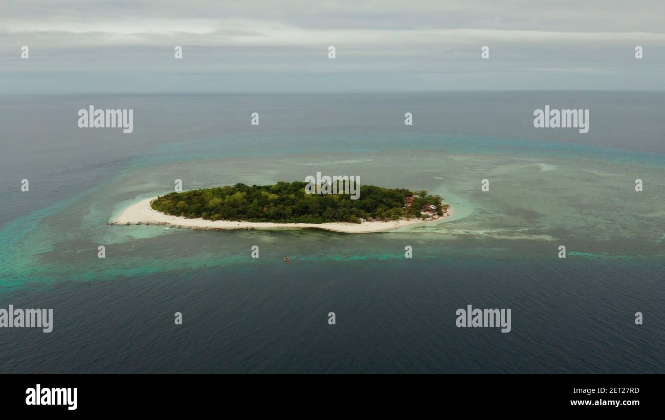 Beautiful beach on tropical island surrounded by coral reef, top view ...