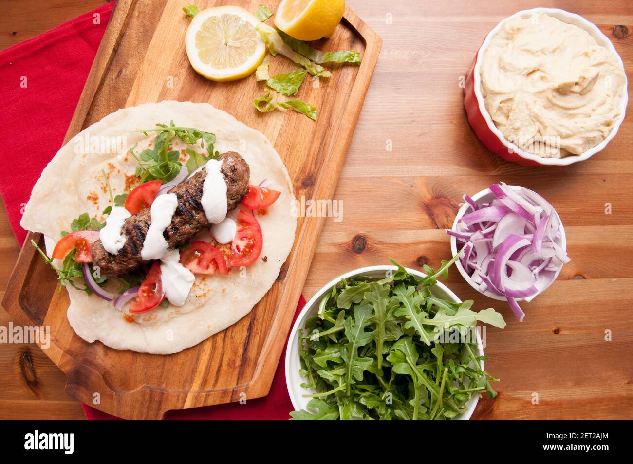 roasted lamb kofte with cool yogurt tzatziki and hummus Stock Photo - Alamy