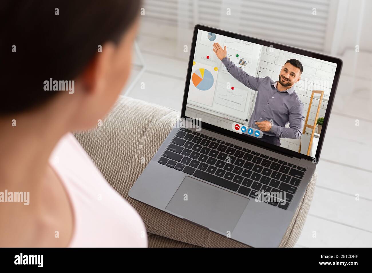 Unrecognizable female having online lesson with male business coach via ...