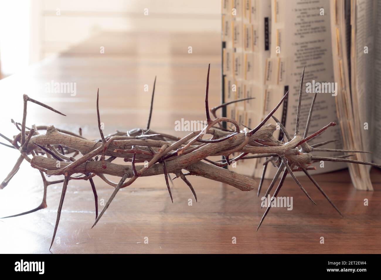 Crown of thorns and Christian bible on a wood table Stock Photo - Alamy