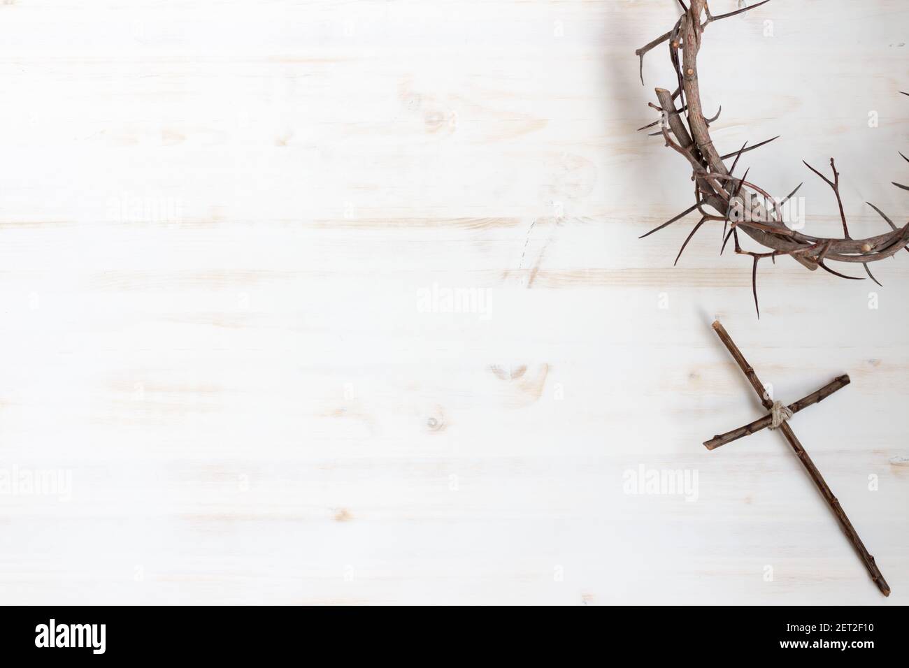 Lenten border with rustic wood cross and crown of thorns on white wood ...