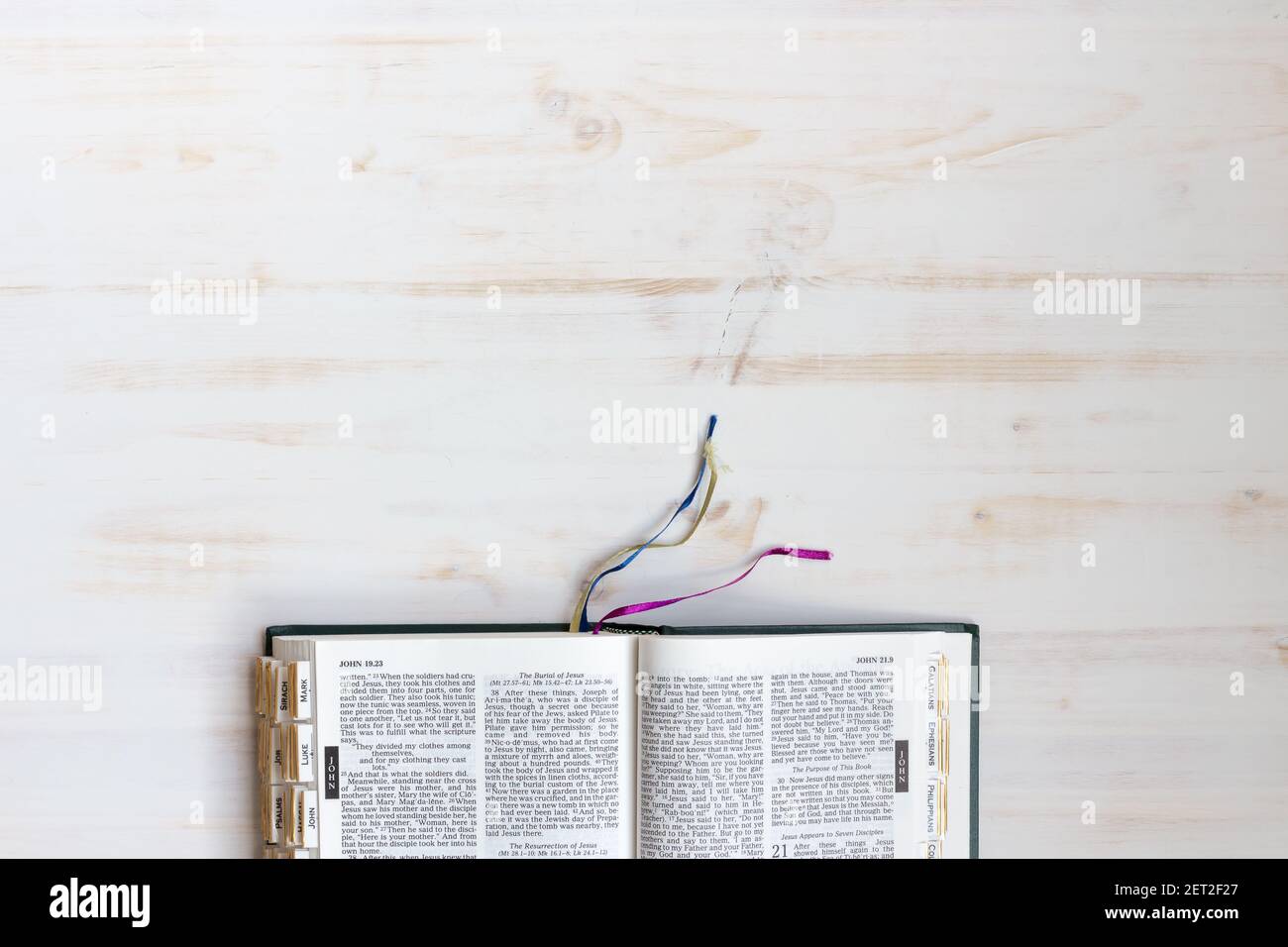 Open bible on a white wood background with copy space Stock Photo - Alamy